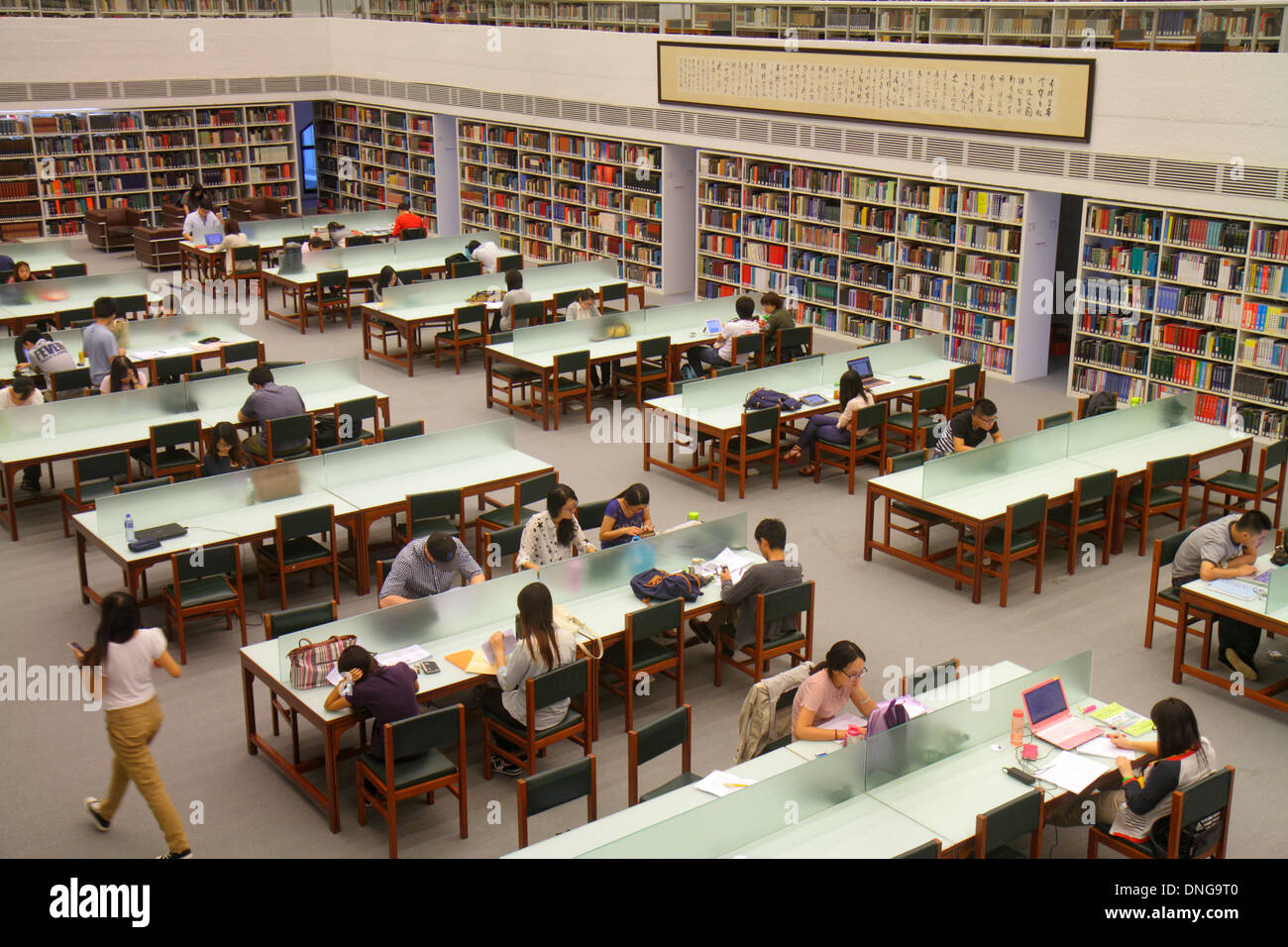 Asian woman with library books hi-res stock photography and images - Alamy