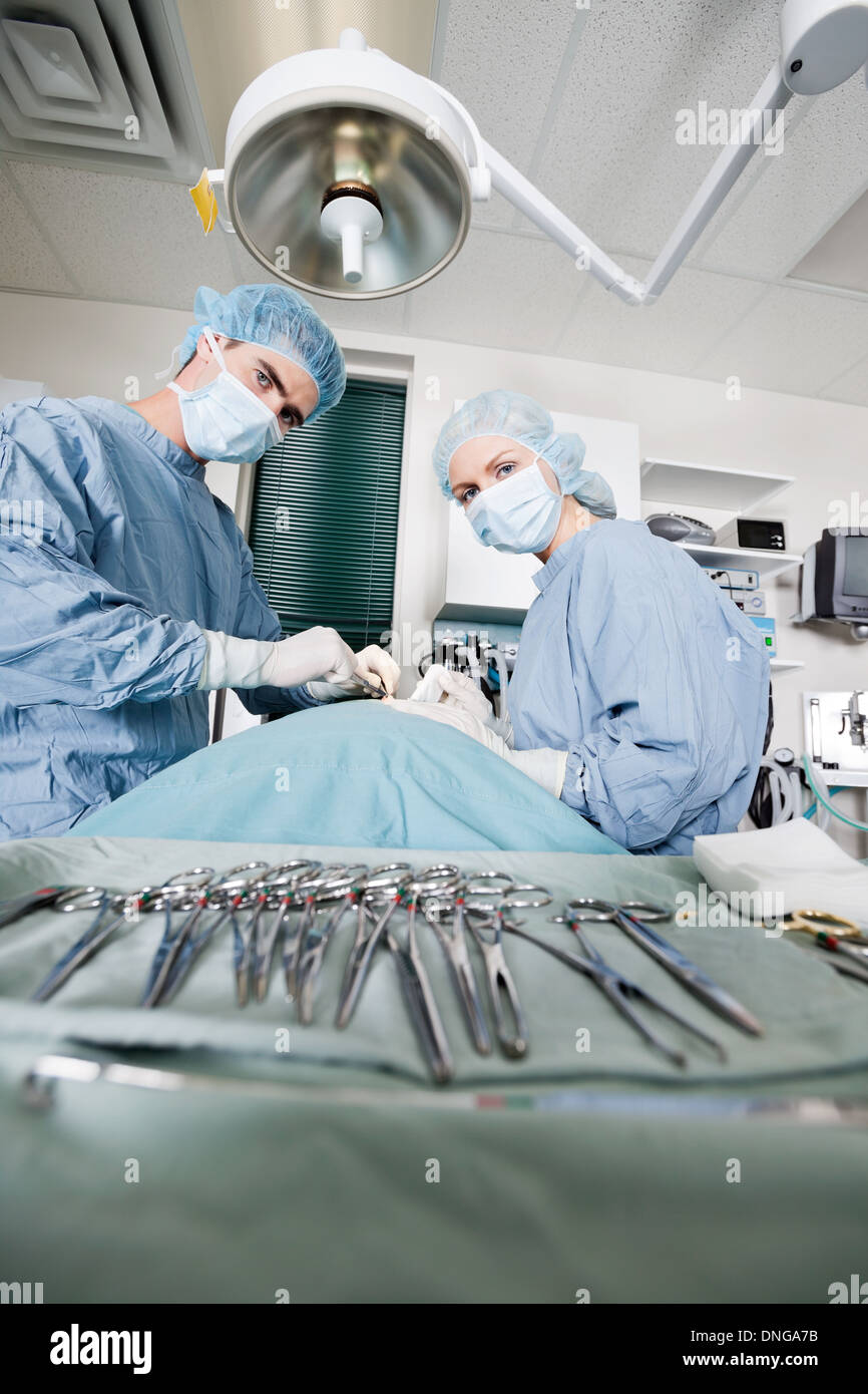Portrait doctor performing surgical operation hi-res stock photography ...