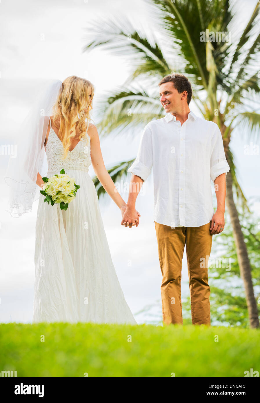 Just married couple holding hands, Intimate loving moment at wedding ...