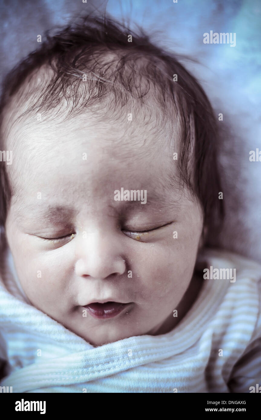 Life, new born baby curled up sleeping on a blanket, multiple ...