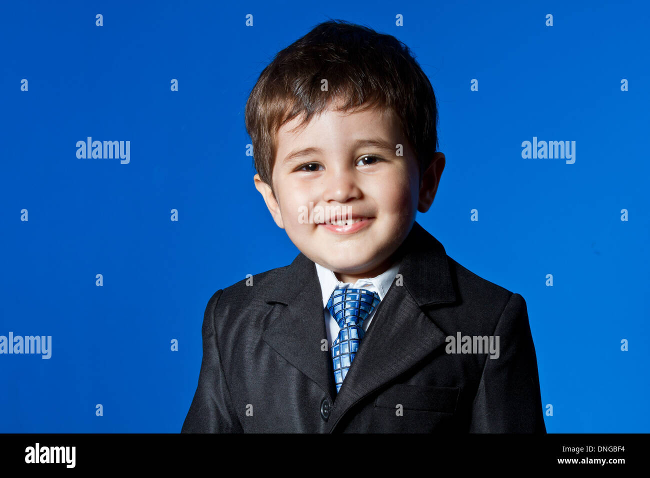 Success, cute little boy portrait over blue chroma background Stock ...