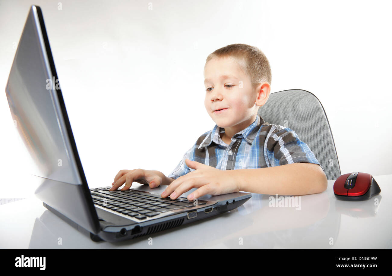 Computer addiction child boy with laptop notebook white background ...