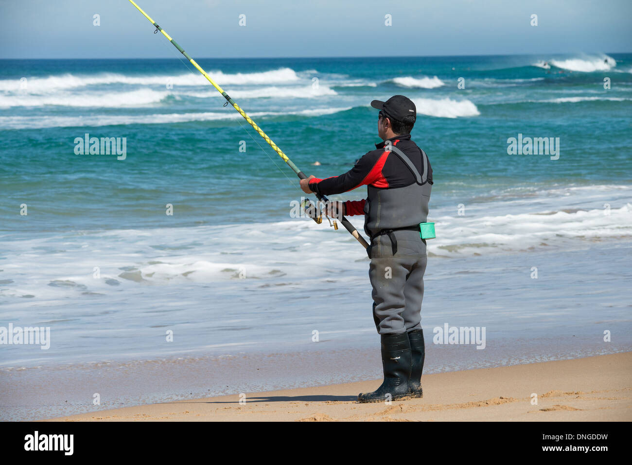 coastal fishing on surf beach Stock Photo - Alamy