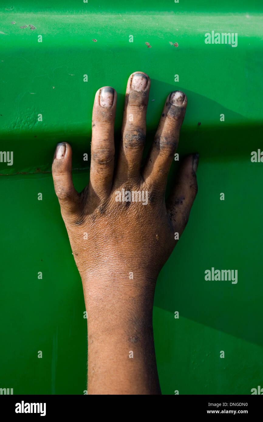 A scavenger boy is holding on to a garbage truck at the toxic Stung ...