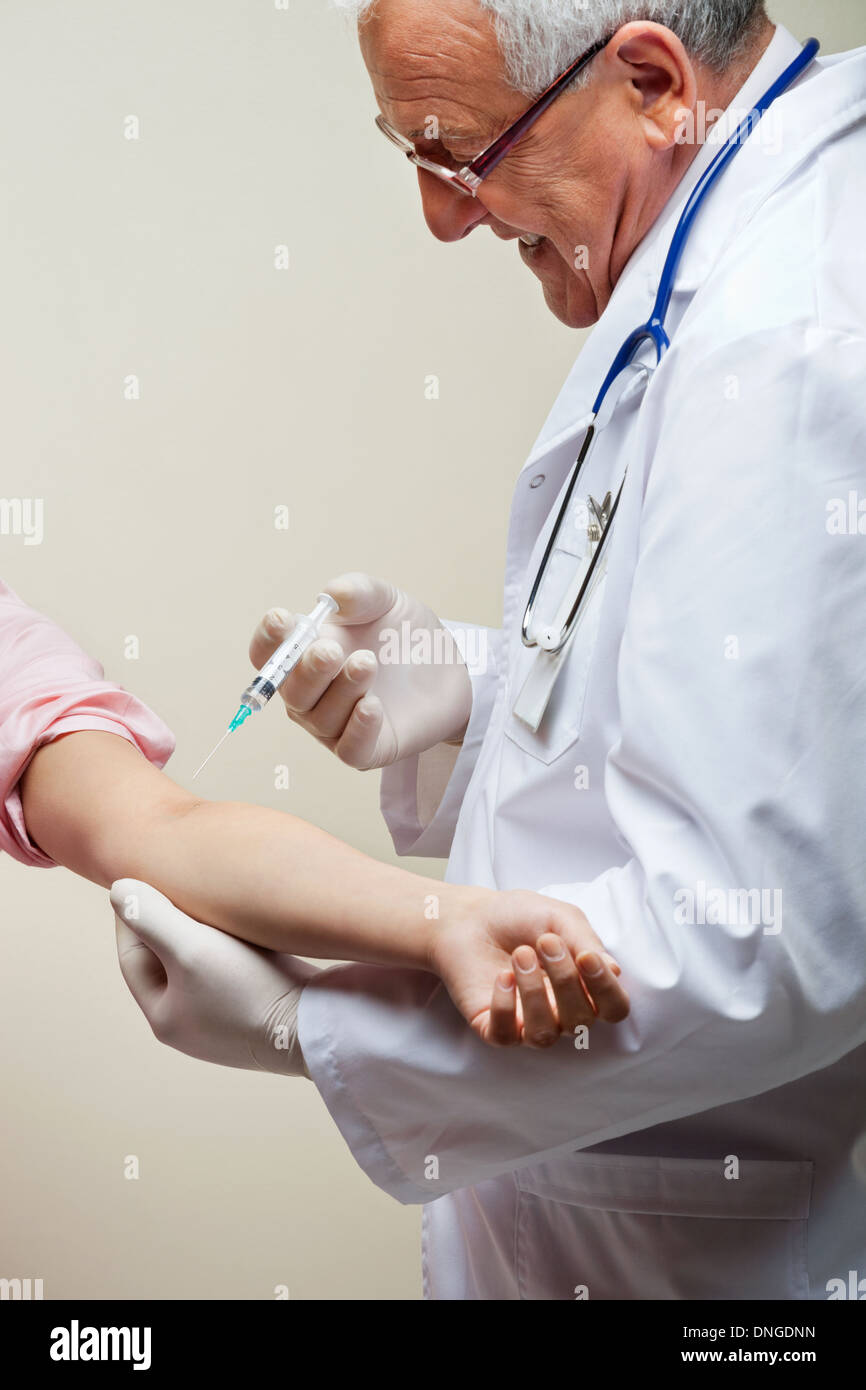 Injection in Arm Stock Photo - Alamy