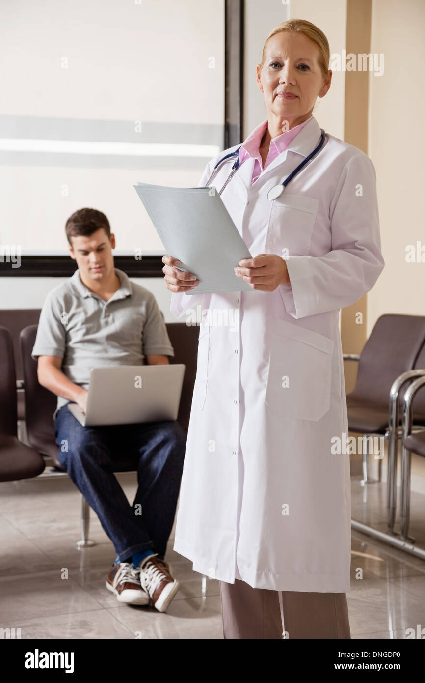 Female Doctor Holding File Stock Photo - Alamy