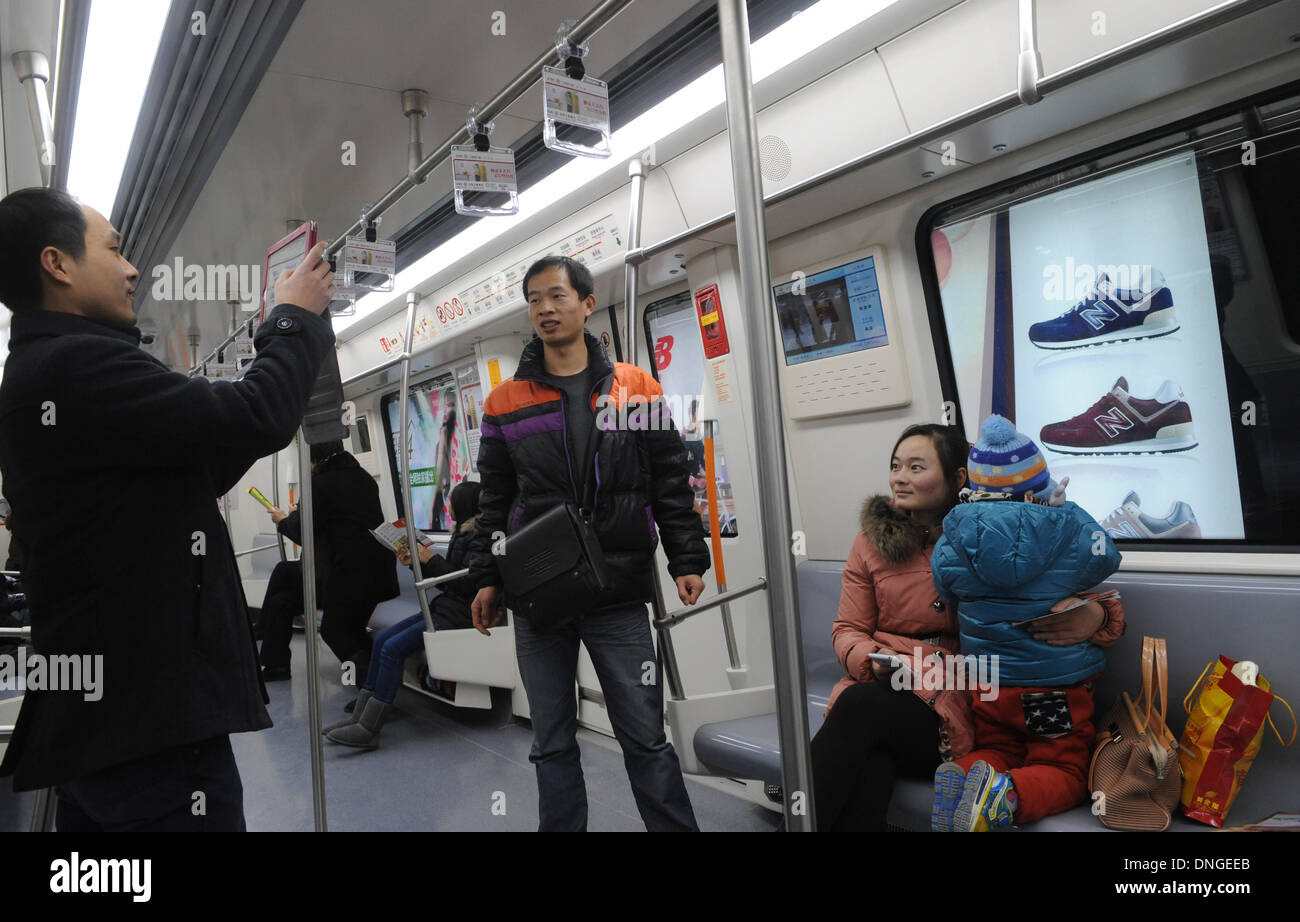 Zhengzhou, China's Henan Province. 28th Dec, 2013. People take photos ...
