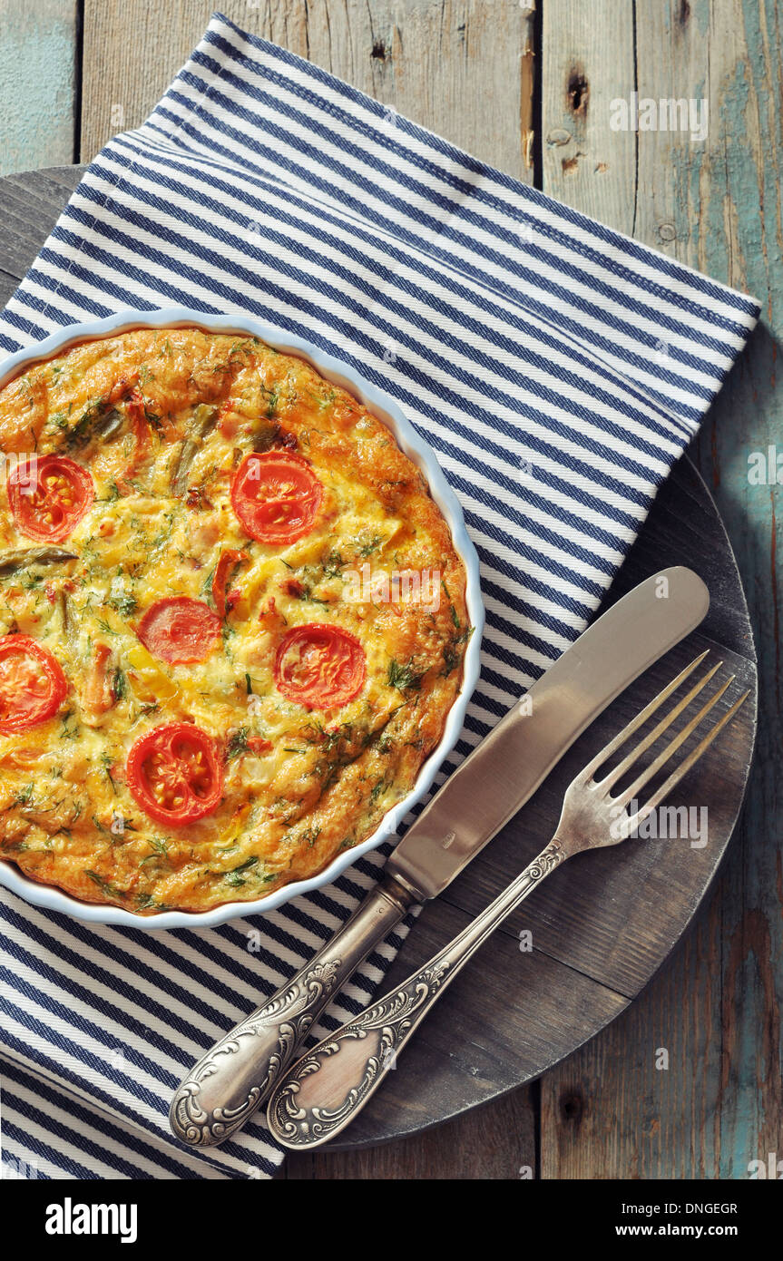 Frittata with Fresh Vegetables and chicken meat in baking mold Stock ...