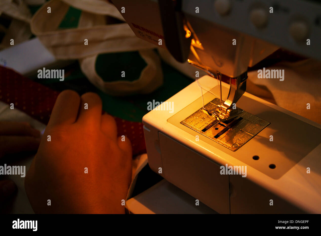 Sewing machine repairs are fabric in industry Stock Photo - Alamy