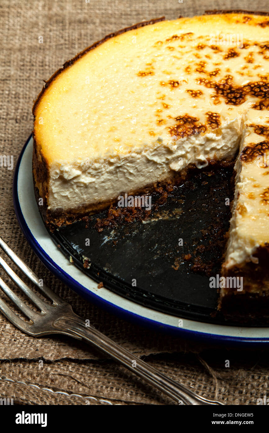 Homemade New York cheesecake with a slice missing Stock Photo - Alamy