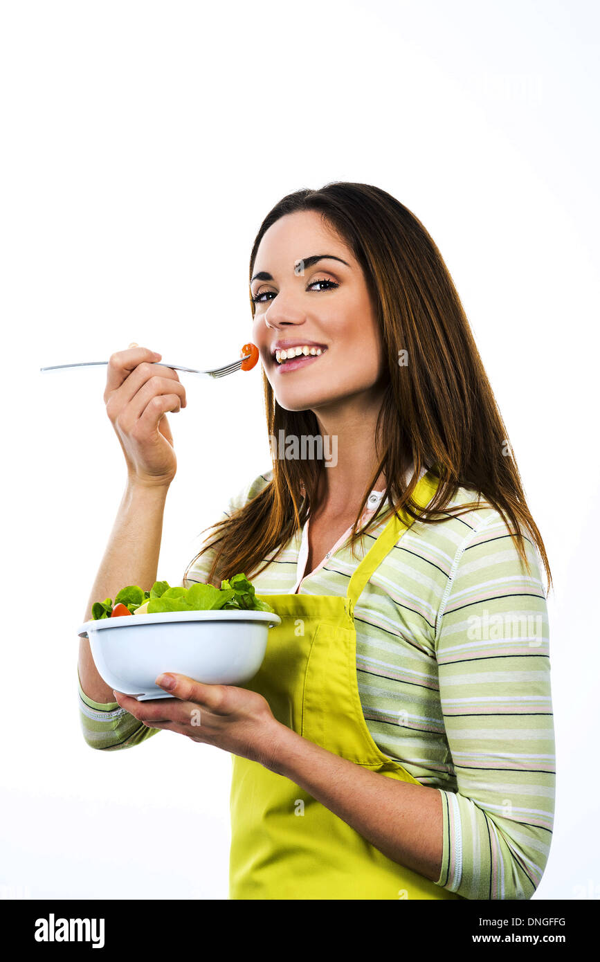 woman is cooking and eating vegetables Stock Photo - Alamy