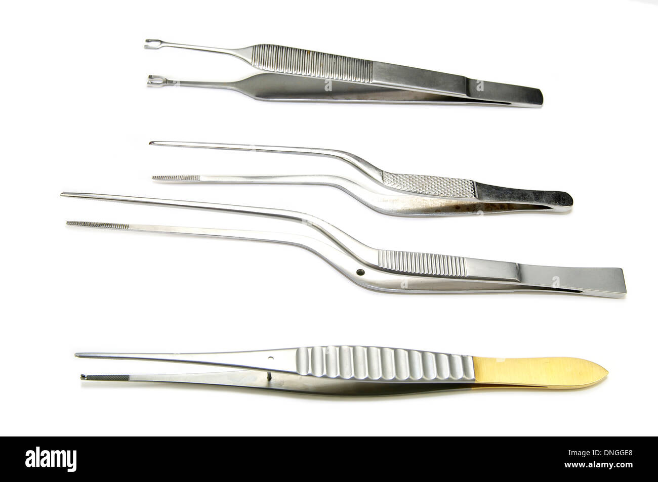 new metal surgical instruments on white background Stock Photo - Alamy