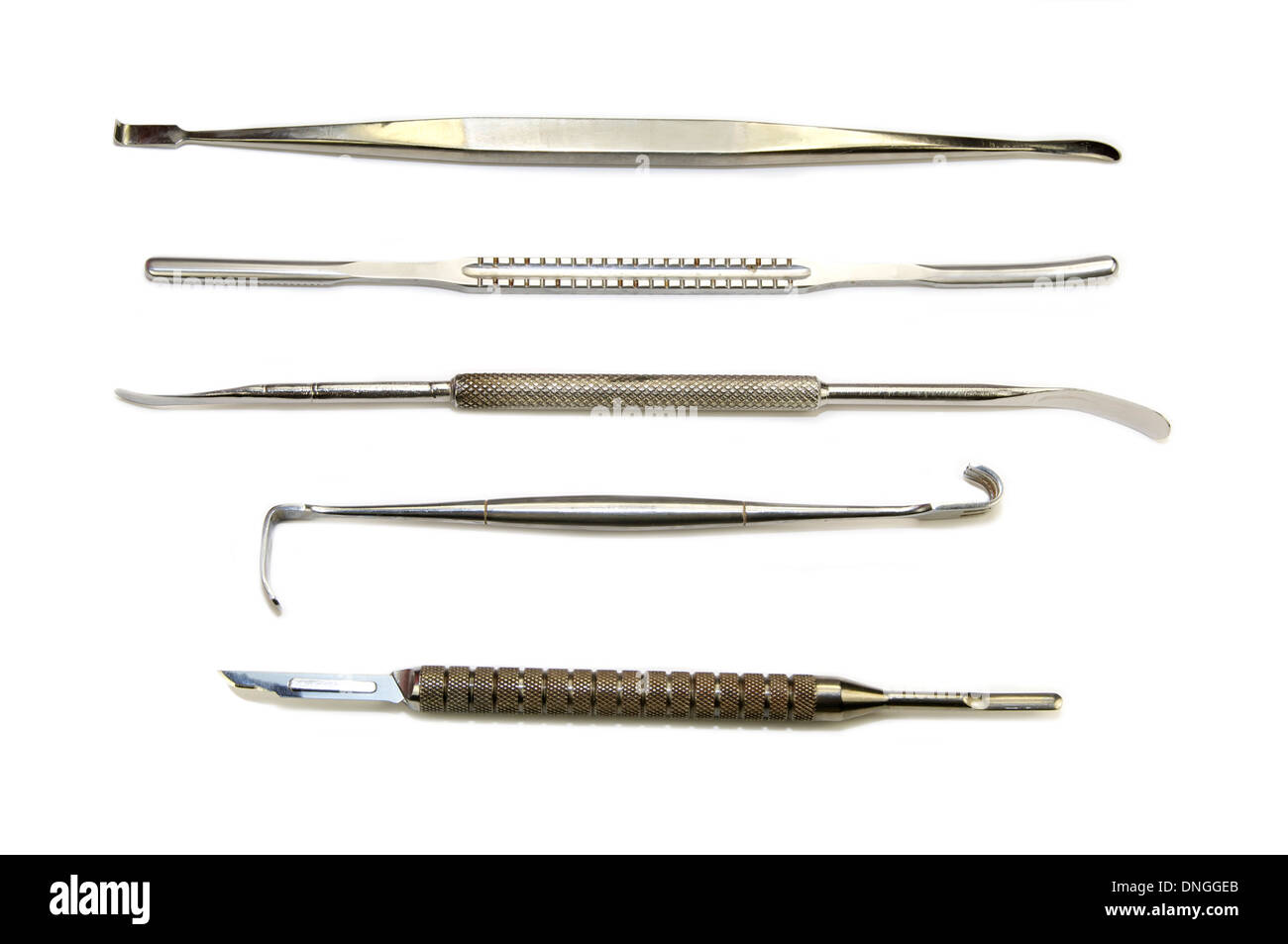 new metal surgical instruments on white background Stock Photo - Alamy