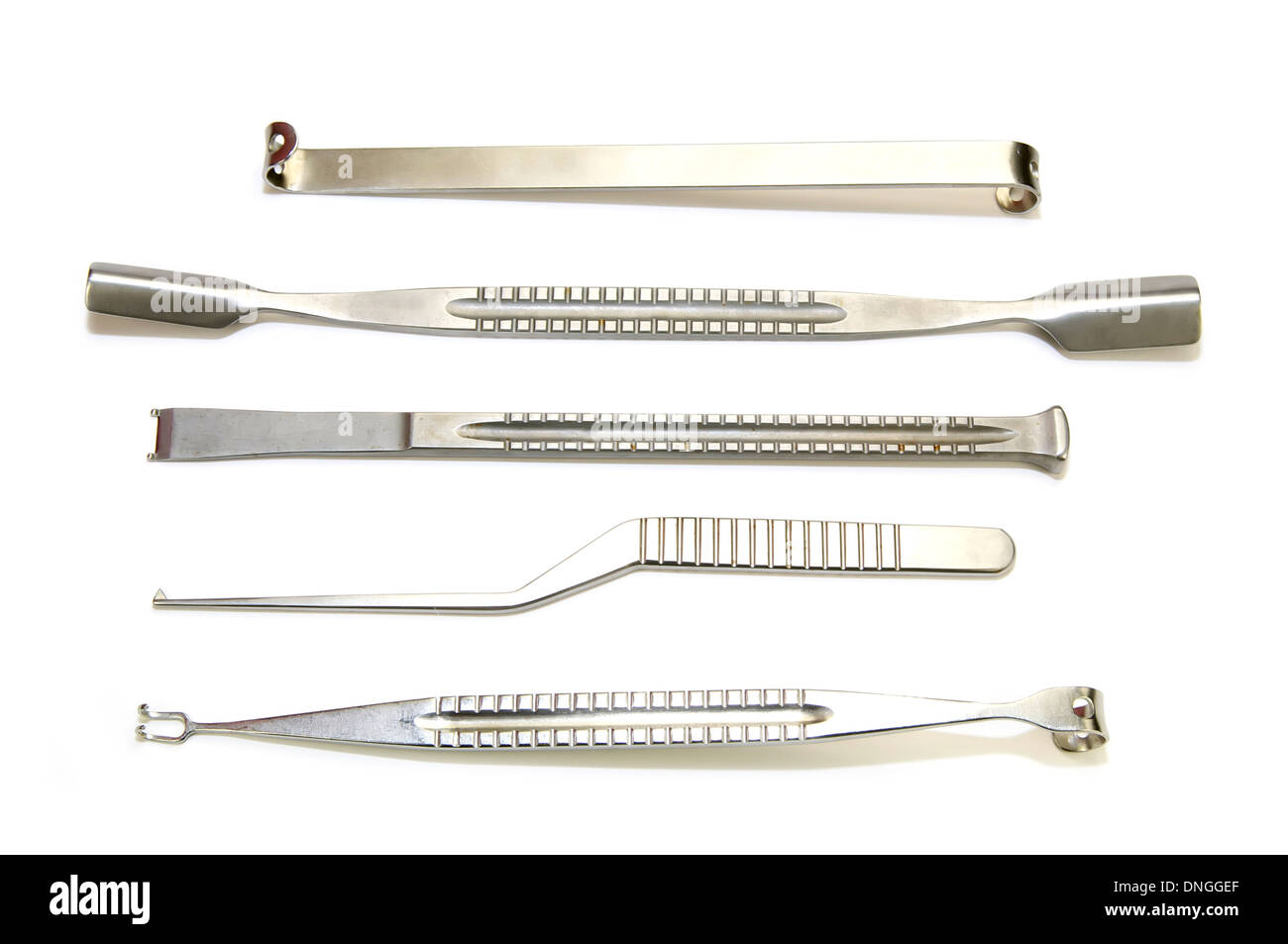 new metal surgical instruments on white background Stock Photo - Alamy