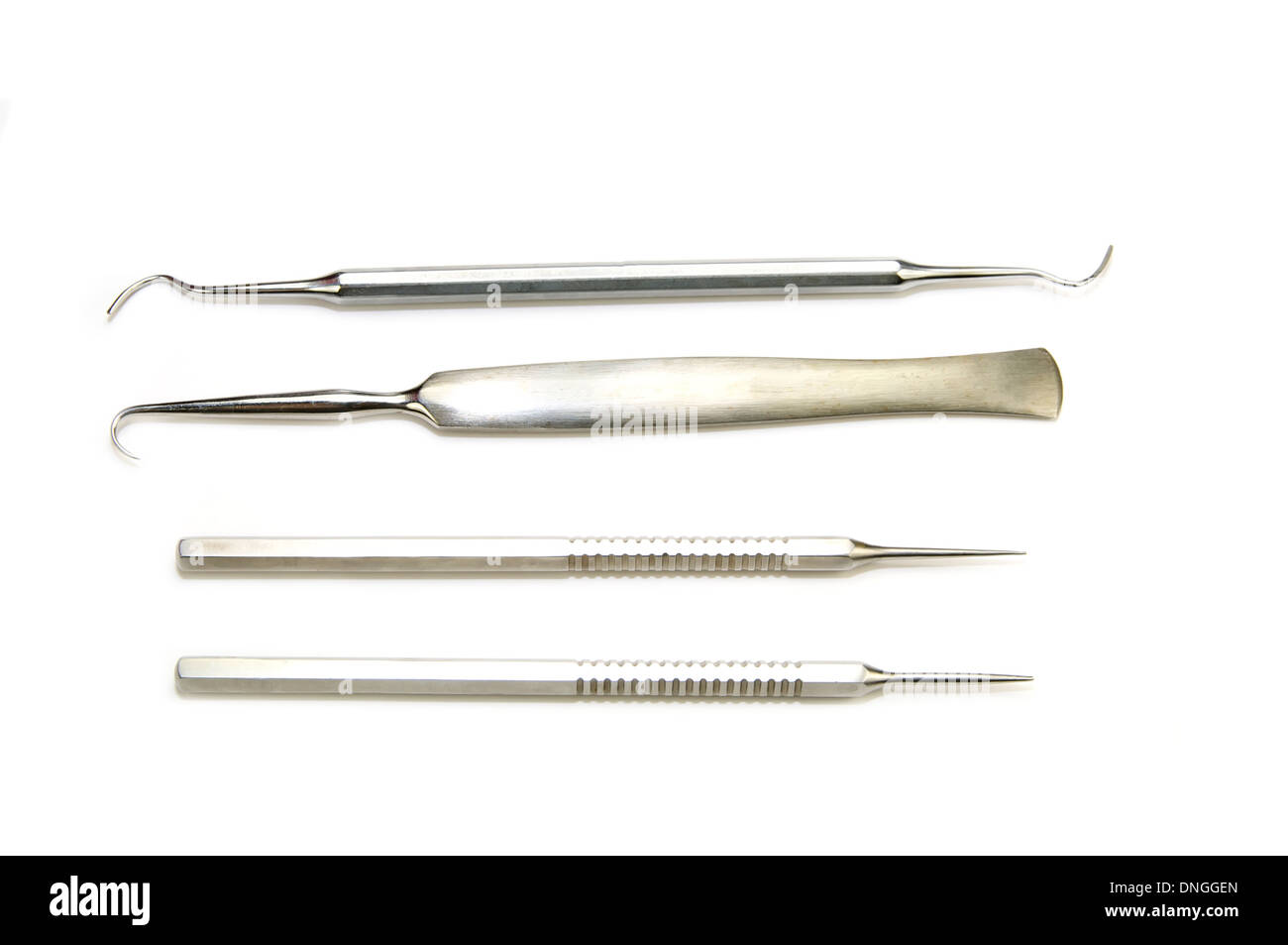 new metal surgical instruments on white background Stock Photo - Alamy