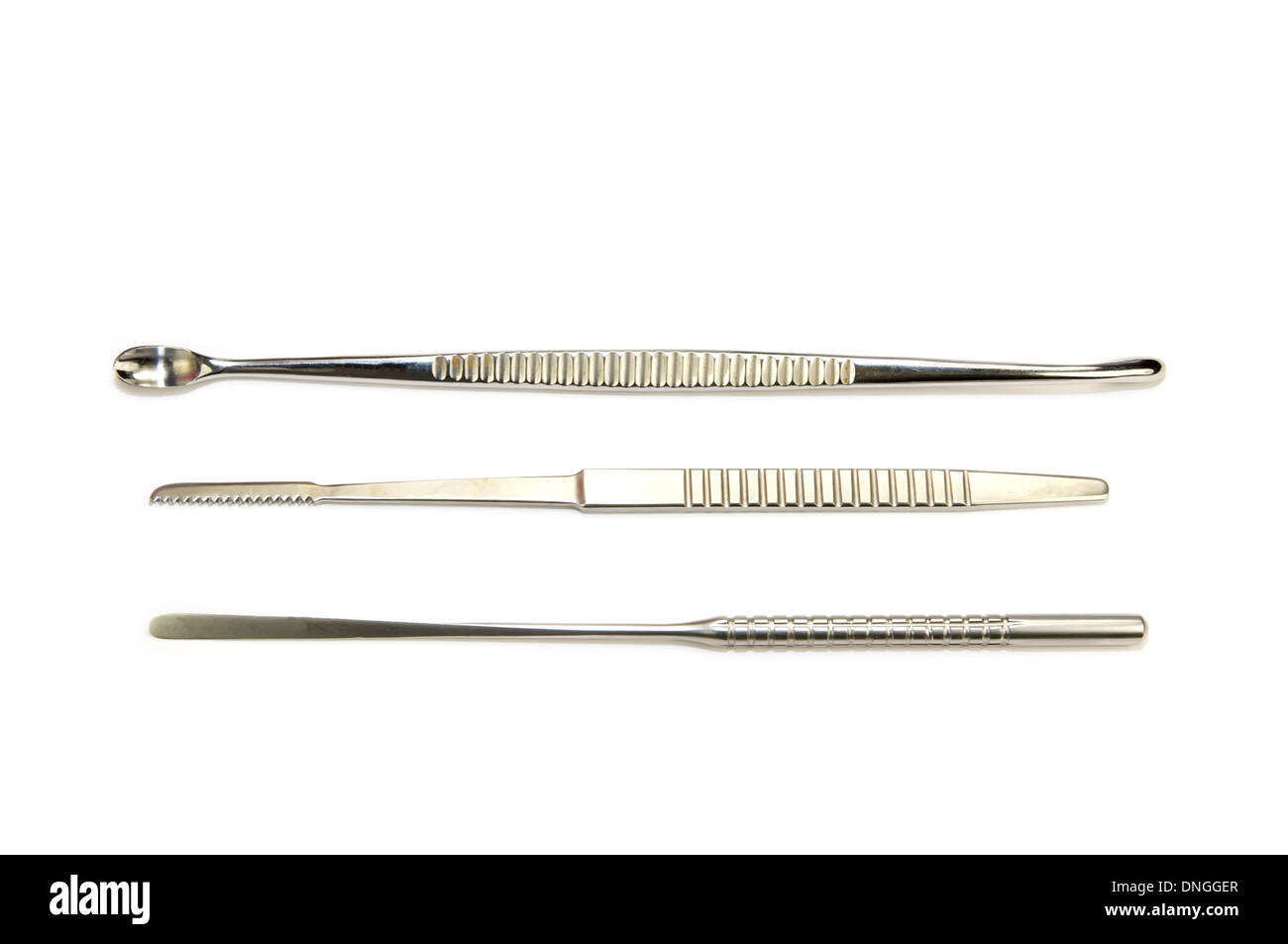 new metal surgical instruments on white background Stock Photo - Alamy