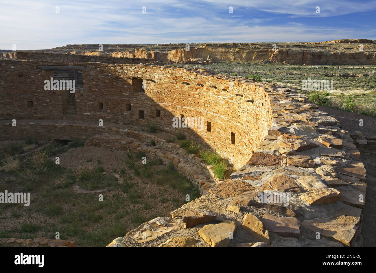 Kiva and sandstone bluffs, Casa Rinconada, Chaco Culture National ...