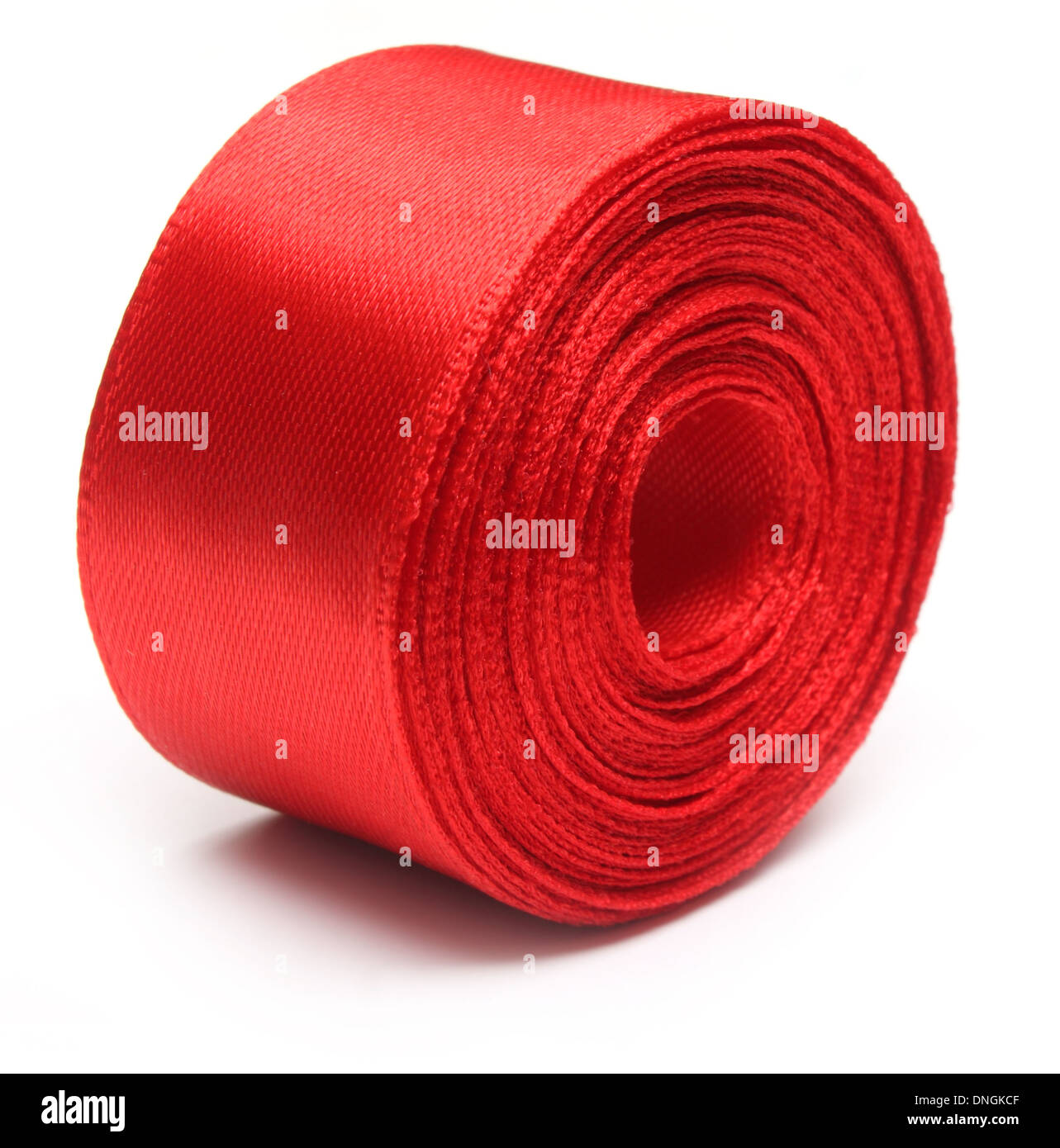 Closeup of red ribbon roll over white background Stock Photo - Alamy