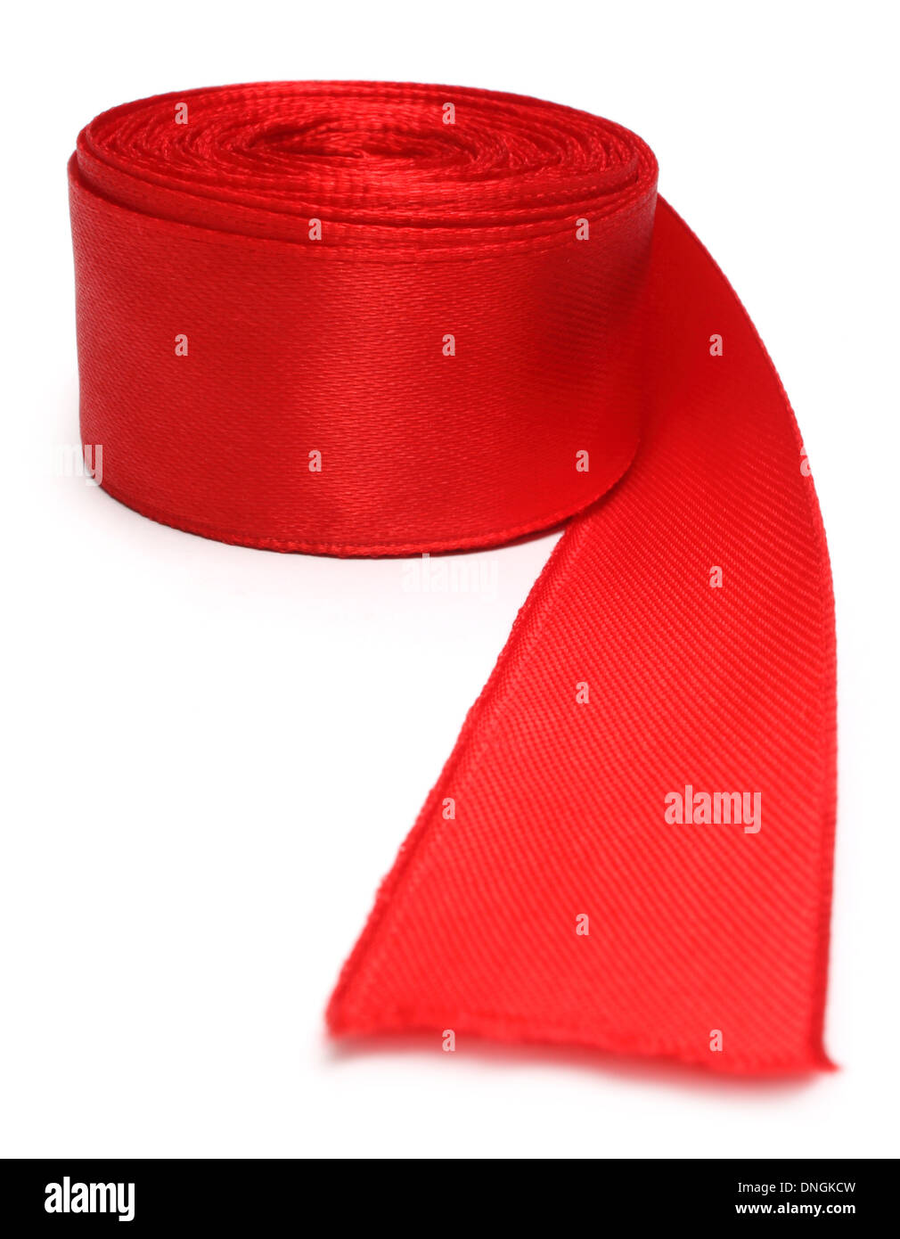 Closeup of red ribbon roll over white background Stock Photo - Alamy