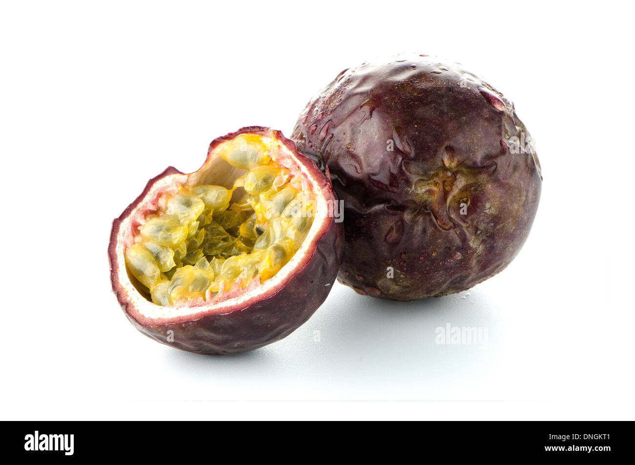 Ripe passion fruit isolated on white background Stock Photo - Alamy