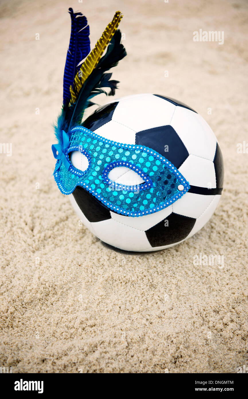 Brazilian soccer ball football wearing sparkly carnival mask on the ...