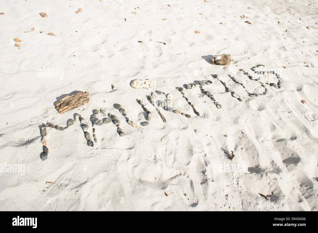 Mauritius written in pebbles on a sandy beach Stock Photo - Alamy