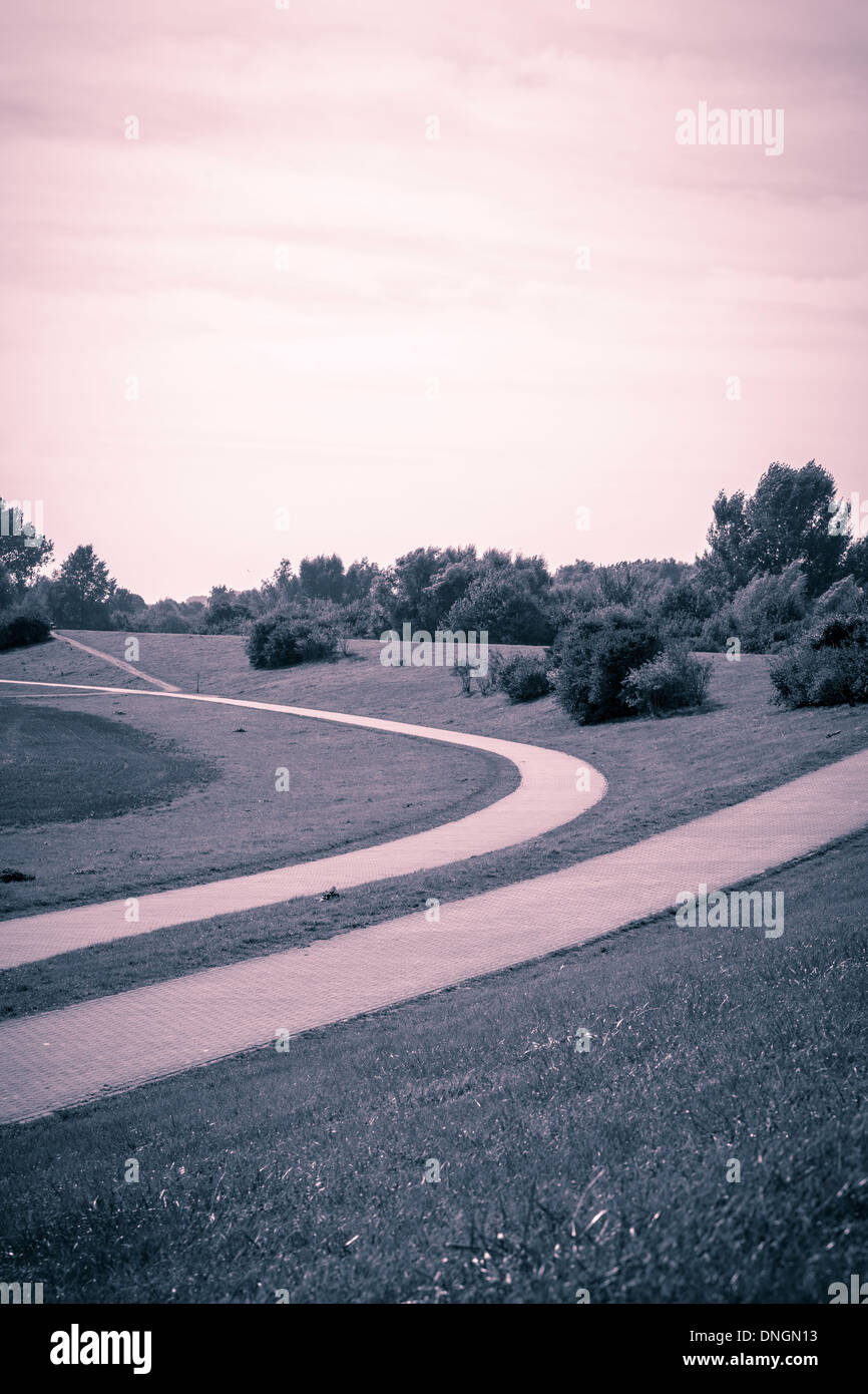 vintage style landscape with curved way's Stock Photo - Alamy