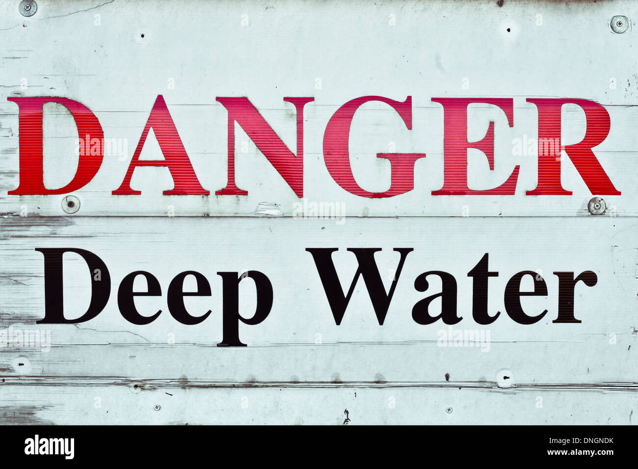 Sign indicating danger from deep water Stock Photo - Alamy