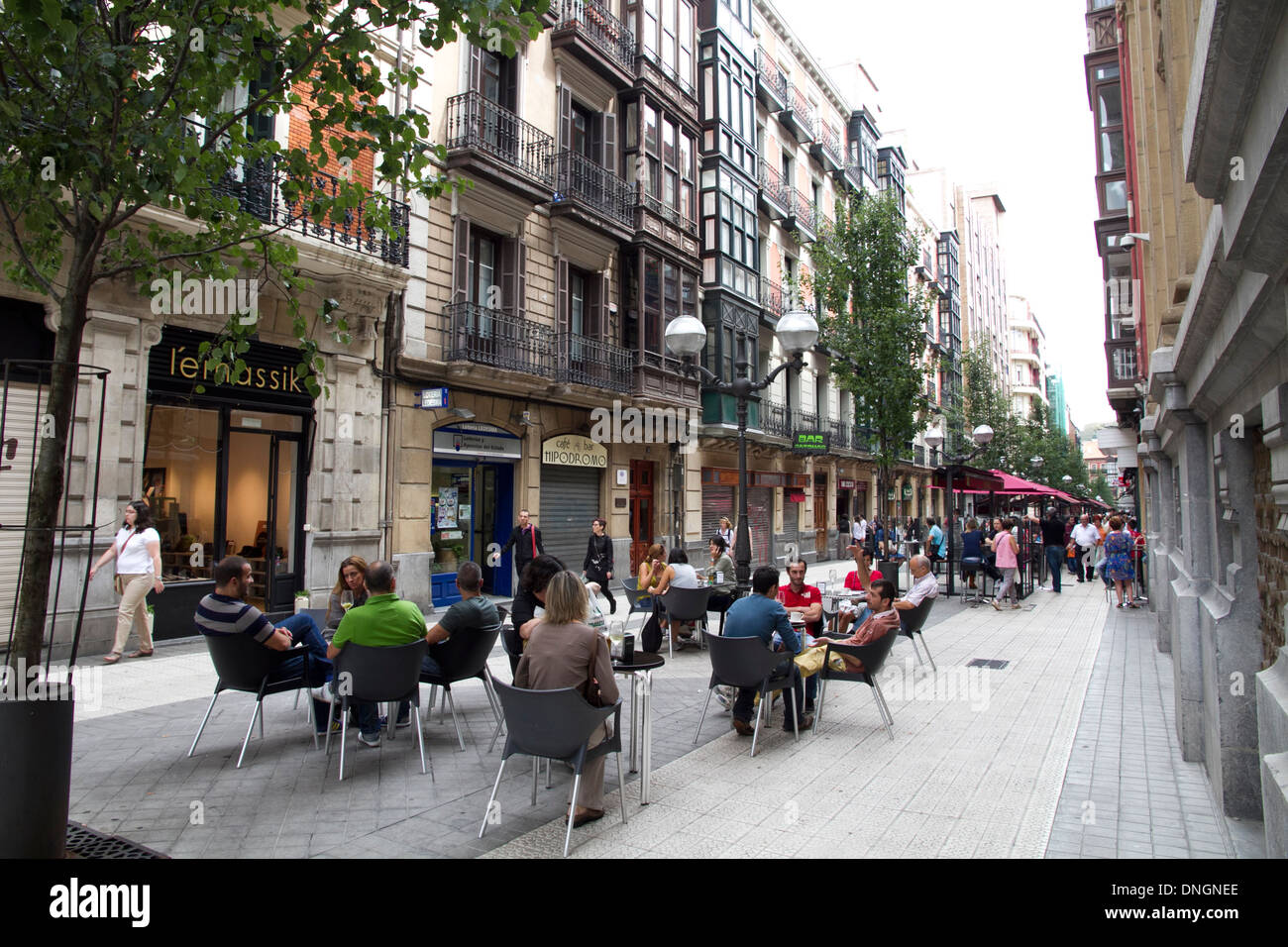 Bilbao Spain bar caffe people in street Stock Photo - Alamy
