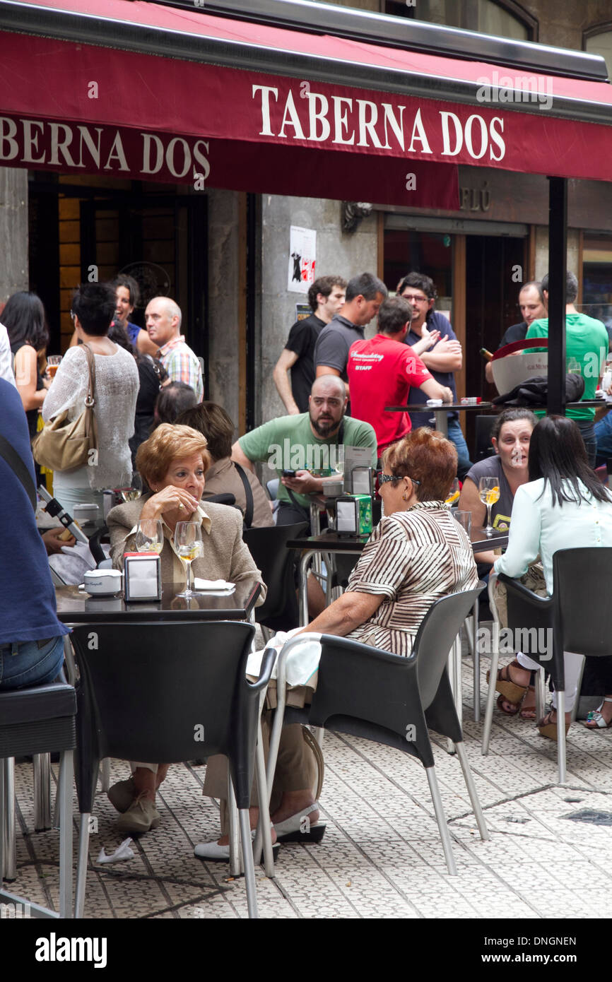 Bilbao Spain bar caffe people in street Stock Photo - Alamy