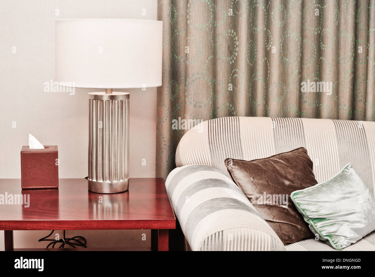 Sofa and table lamp in a sitting room Stock Photo - Alamy