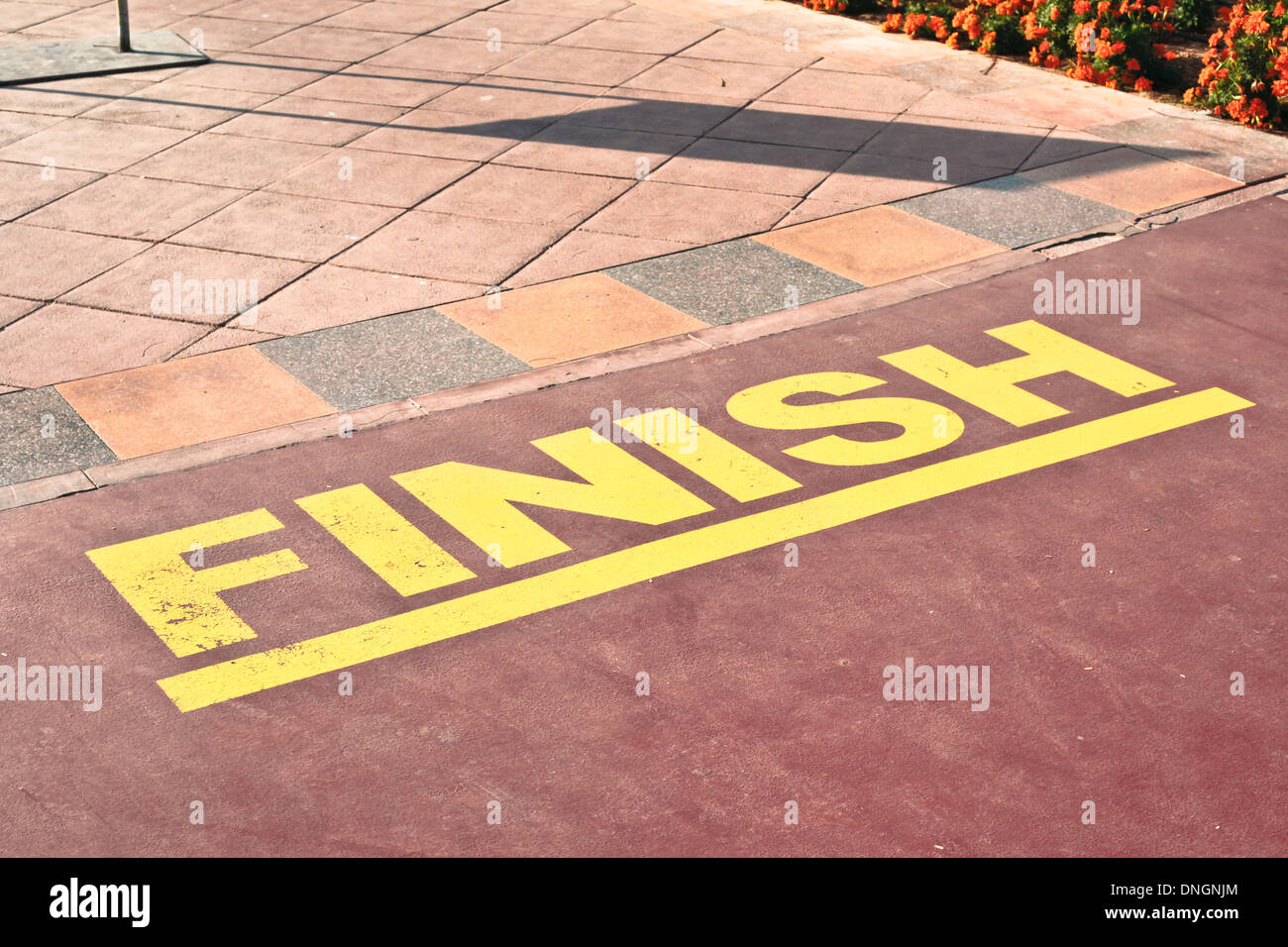 Finish point written on a racing track in yellow letters Stock Photo ...