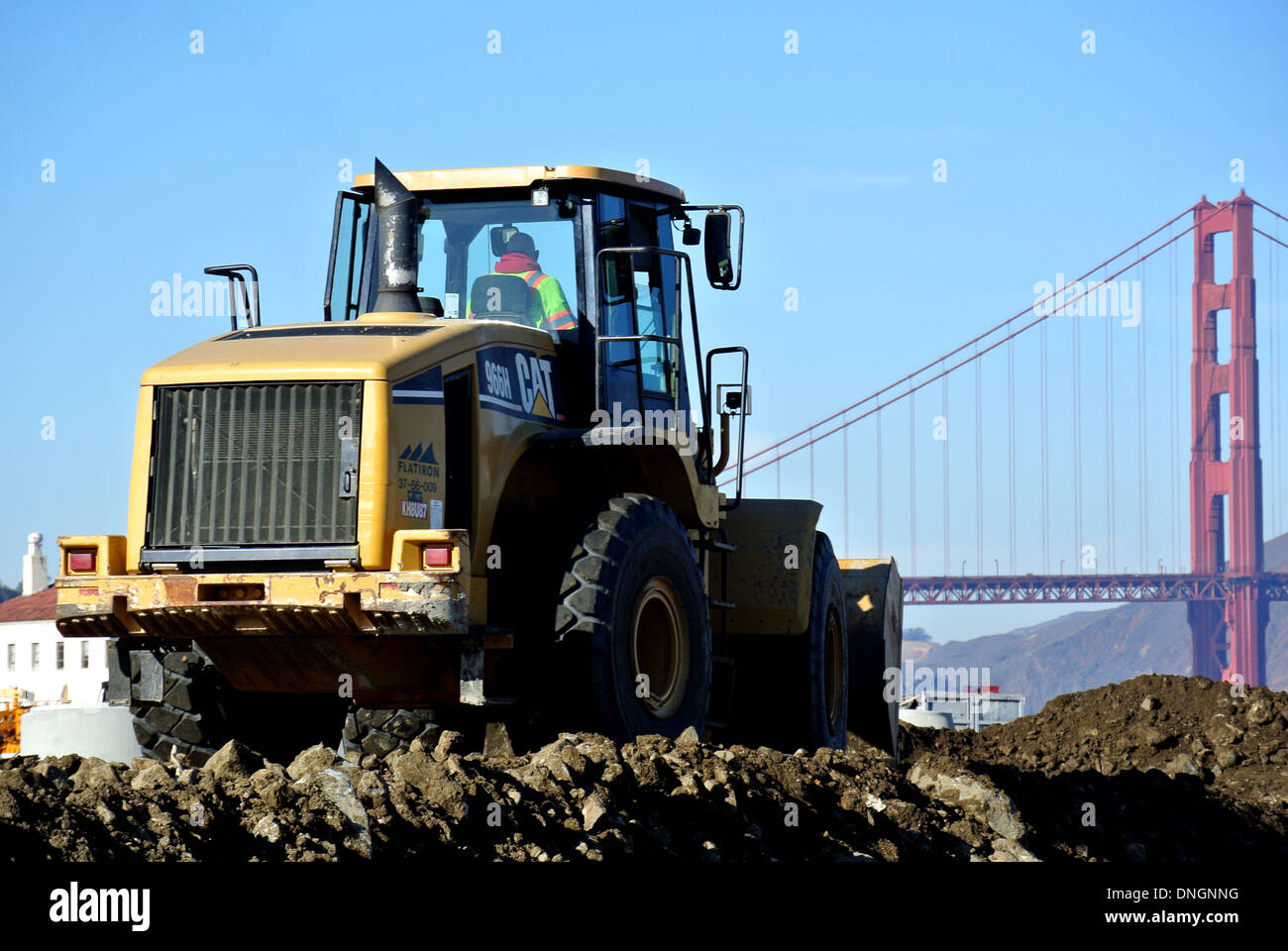 bulldozer on construction site with Golden Gate Bridge in the ...