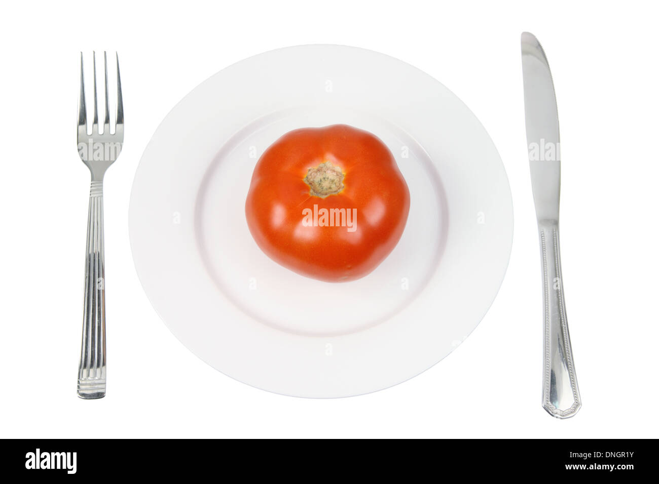 Tomato on plate with fork and knife hi-res stock photography and images ...