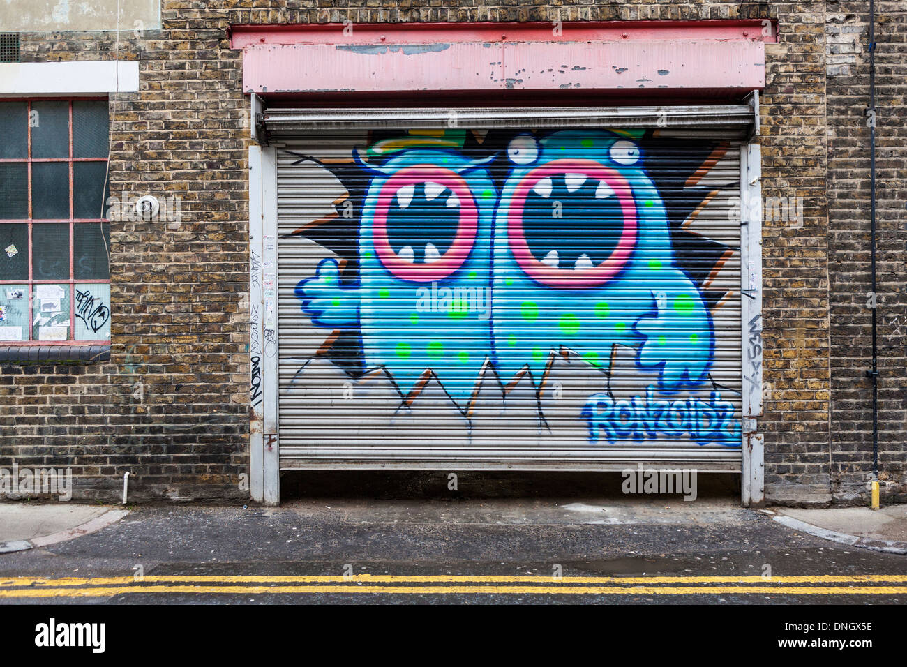Spray paint street art by Ronzo - blue Gap-toothed spotted monster ...