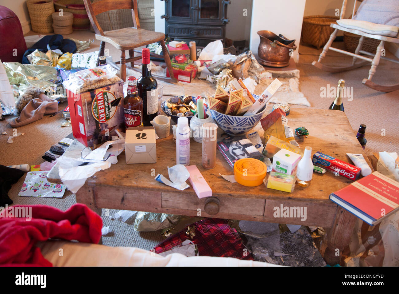 Mess of Christmas presents and wrapping paper scattered around a home ...