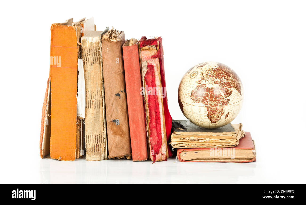 Old books and globe earth isolated on white Stock Photo - Alamy