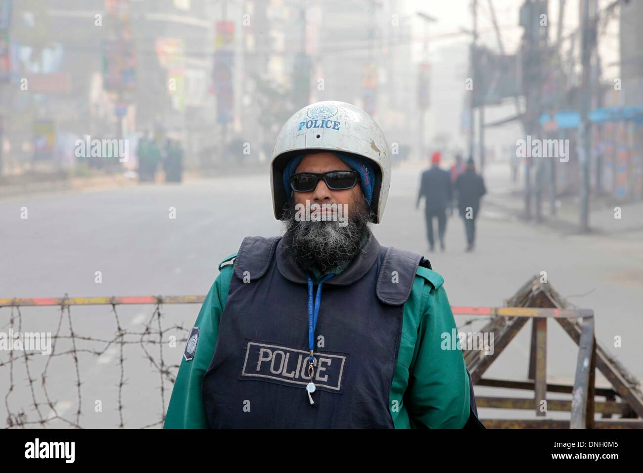 Dhaka, Bangladesh. 29th Dec, 2013. Bangladeshi police stand guard in ...