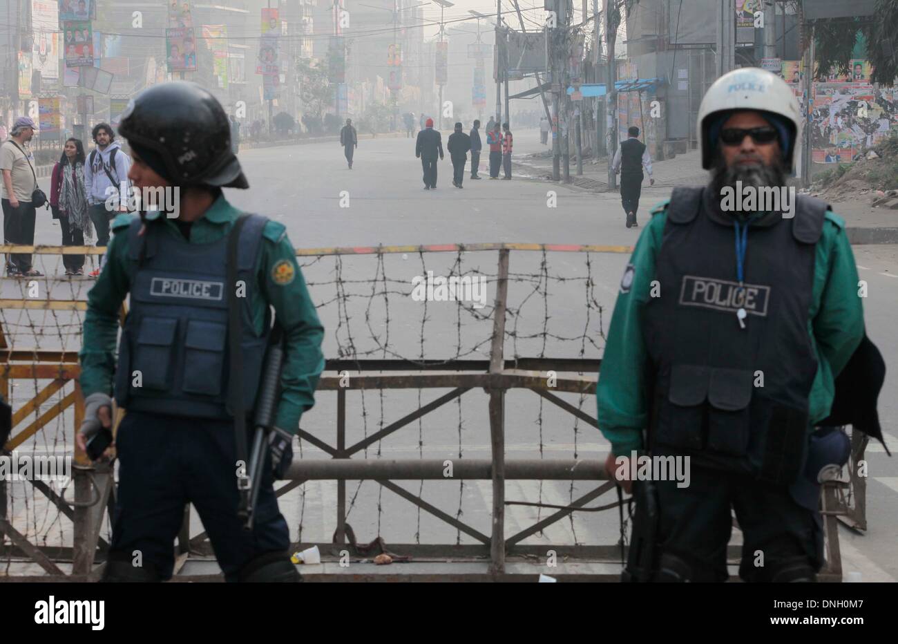 Dhaka, Bangladesh. 29th Dec, 2013. Bangladeshi police stand guard in ...