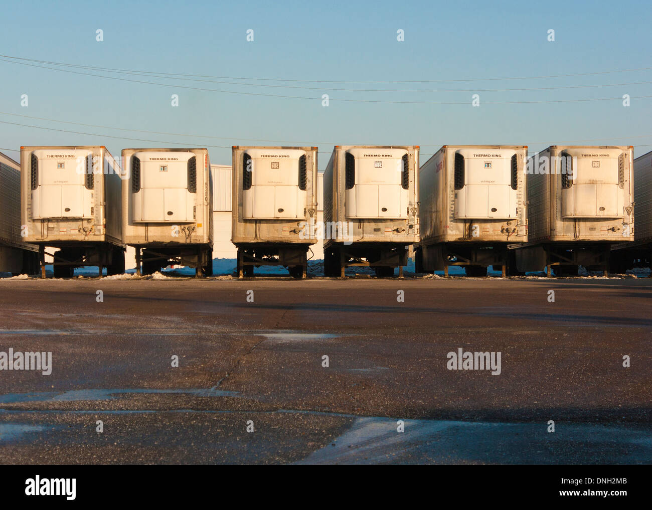 Straight on view of truck trailers in parking lot Stock Photo - Alamy