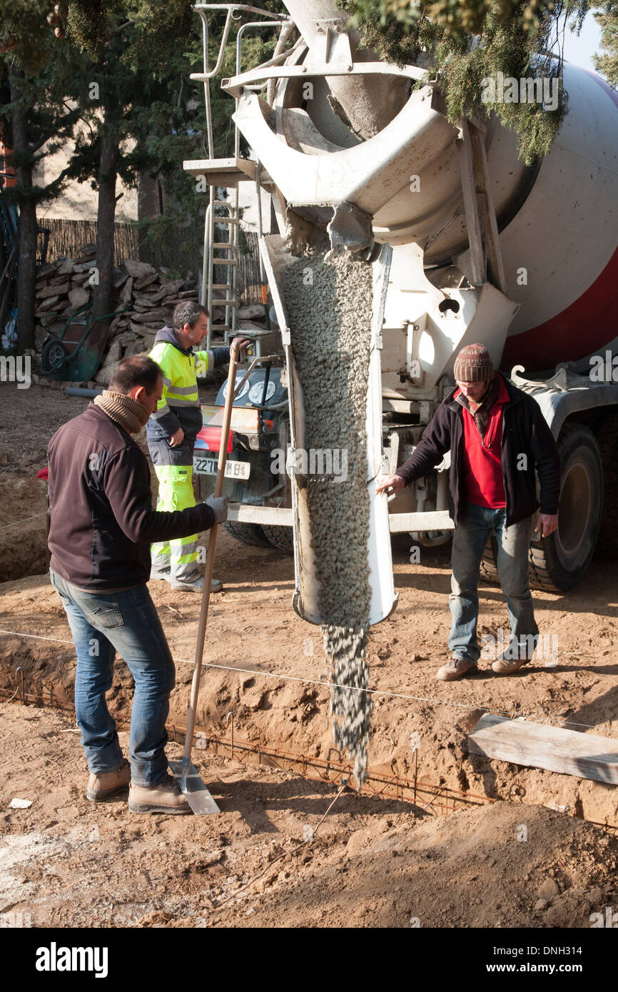 THE DELIVERY AND POURING OF CONCRETE FOR THE FOUNDATION OF THE WALL FOR ...