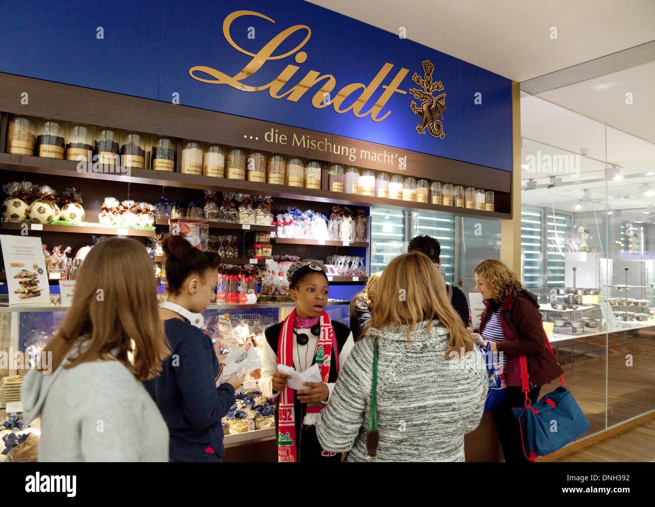 Children buying Lindt chocolate at the shop in the Lindt Chocolate ...