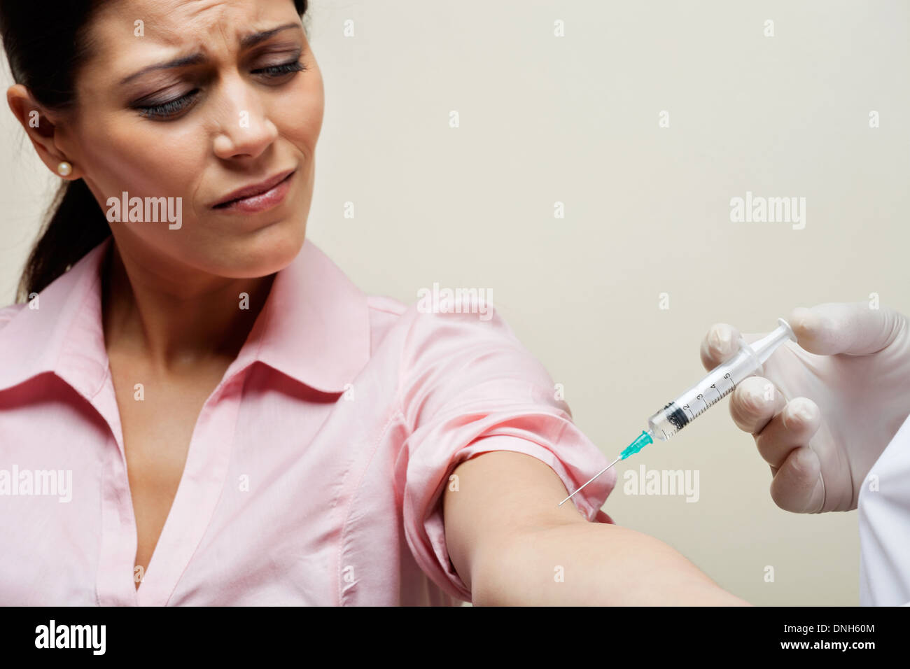 Female Receiving Injection Stock Photo - Alamy