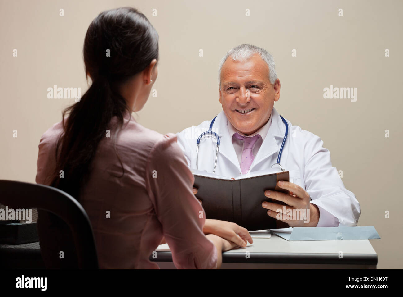 Doctor Looking At Patient Stock Photo - Alamy