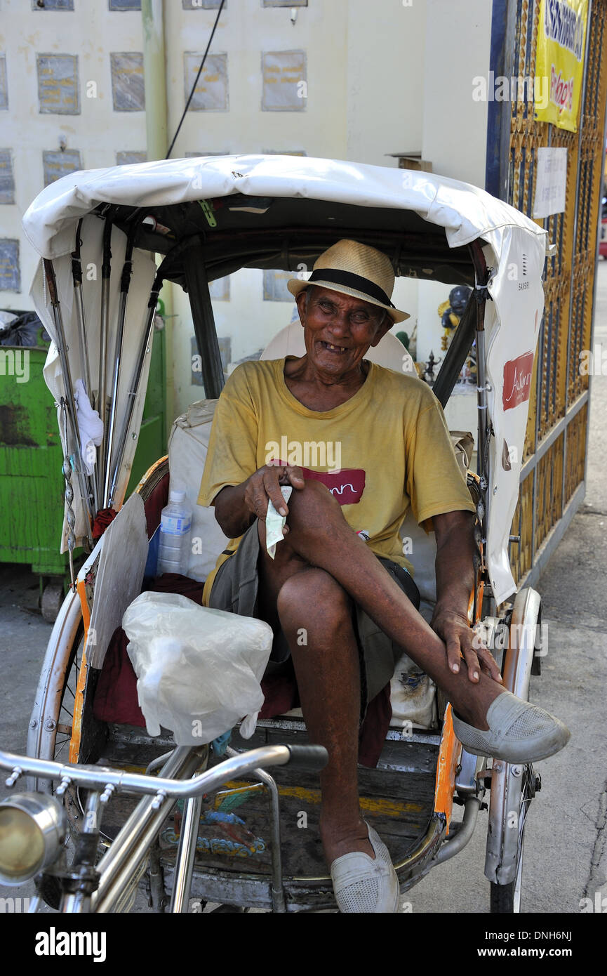 Bicycle Rickshaw Driver waiting for new customer smiling Stock Photo ...