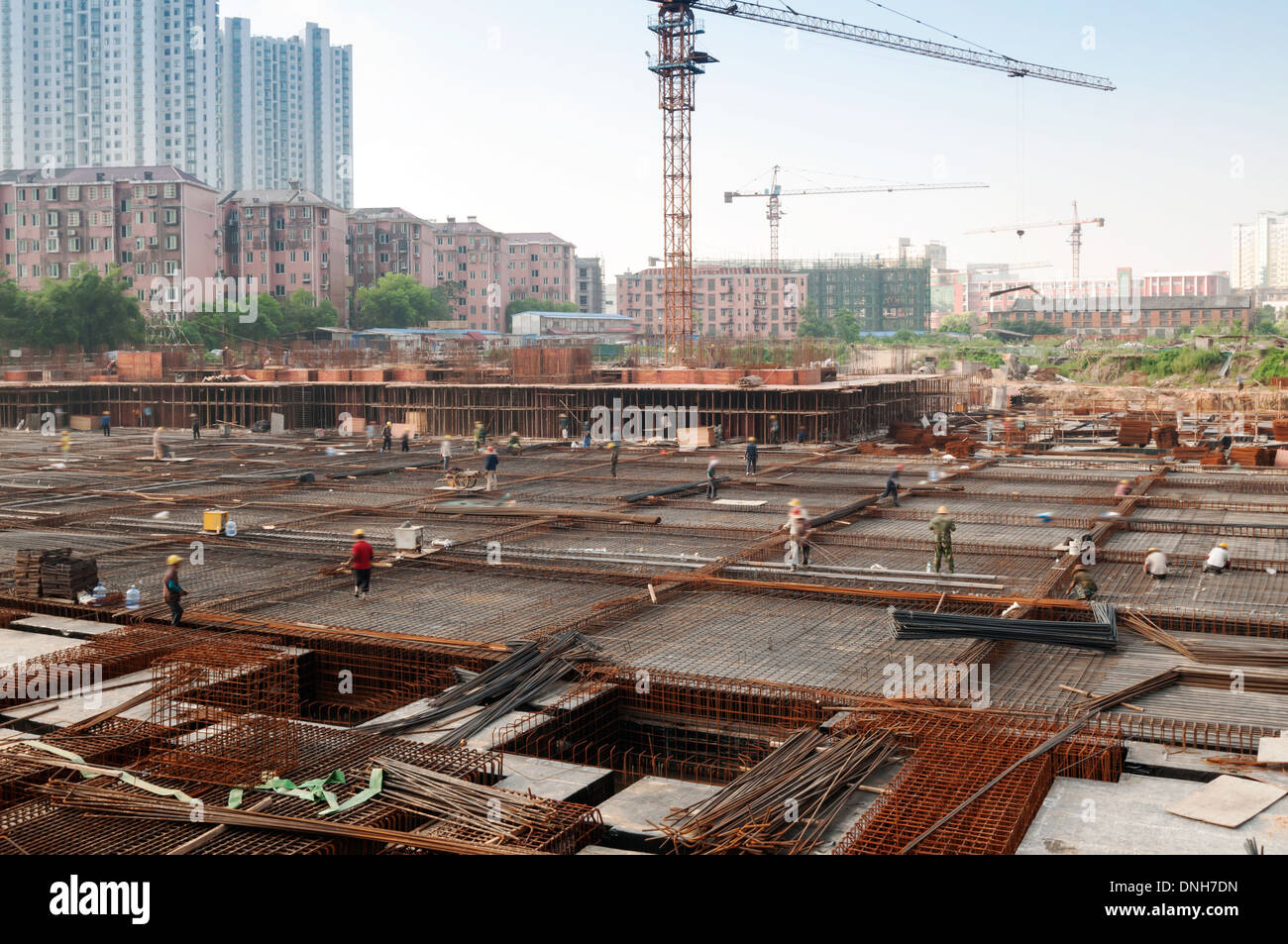 building under construction with workers Stock Photo - Alamy