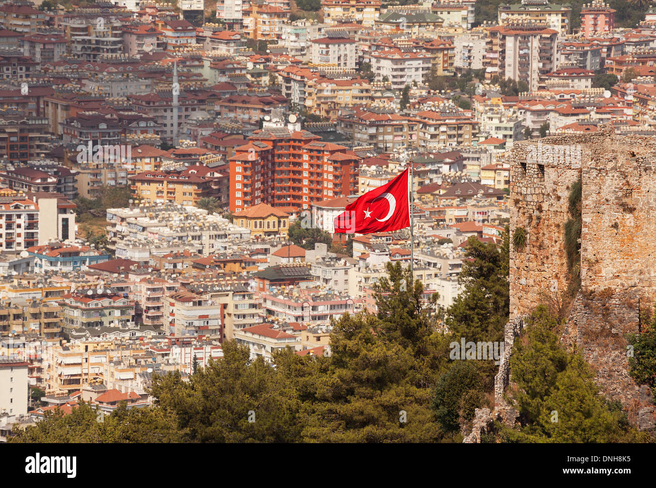 Turkish flag on a background of Alanya city Stock Photo - Alamy