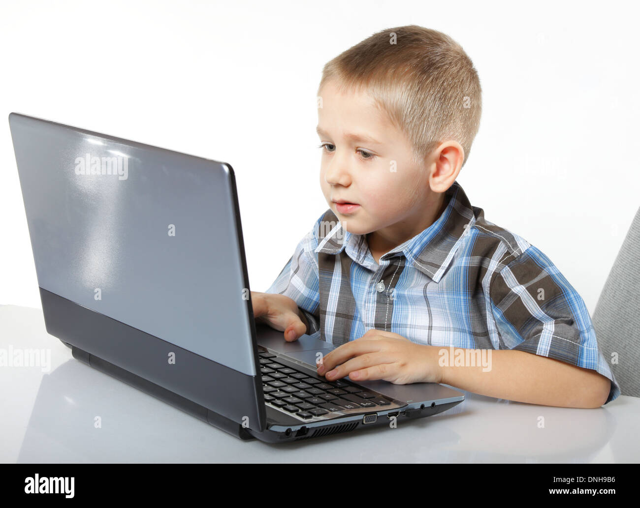 Computer addiction child boy with laptop notebook white background ...