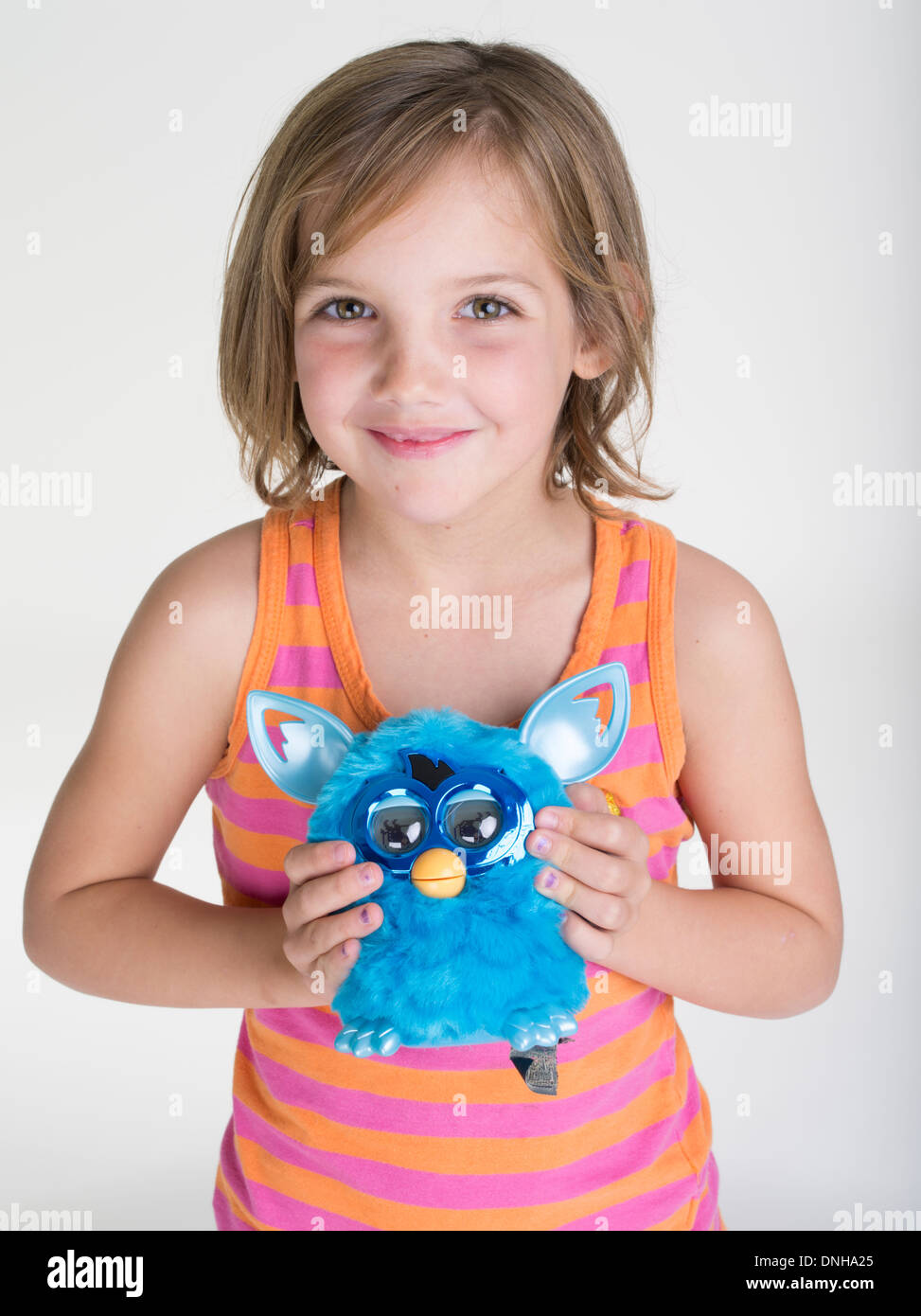 Young Girl with 2013 Furby electronic robotic toy by Tiger Electronics ...