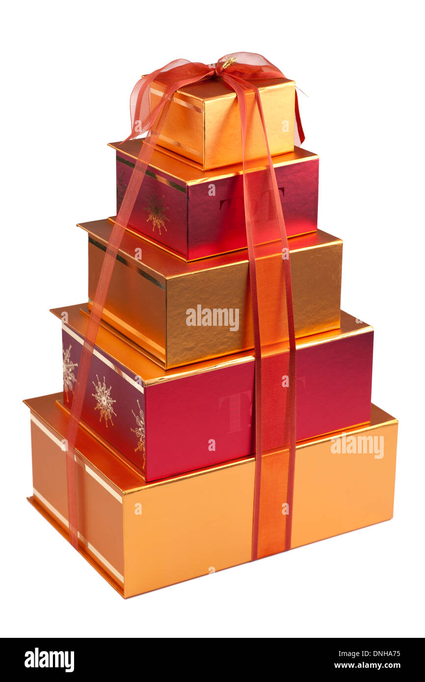 Ribbon tied stack of five red and gold presentation boxes Stock Photo ...